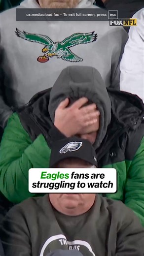 Eagles fans watching their team in a nail-biter at home