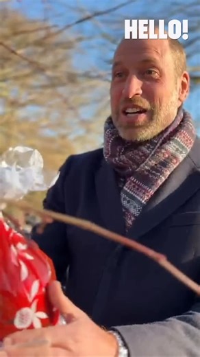 HELLO! Magazine on Instagram: "Watch as Prince Louis snatches chocolate from dad Prince William in hilarious moment - we love how excited he is about his Christmas gift! 🎁❤️"