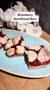 2.6K views · 106 reactions | RECIPE --> https://fedbysab.com/strawberry-shortbread-bars/ Strawberry Shortbread Bars combine a buttery shortbread crust with strawberry pie filling and a sweet vanilla glaze for an easy, fruity dessert! | fedbysab.com | Facebook