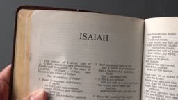 Turning bible pages, from the book of Prophets, Daniel. Close up view.