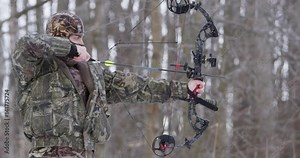 bow hunter pulls arrow back epic slow motion 120fps 4k