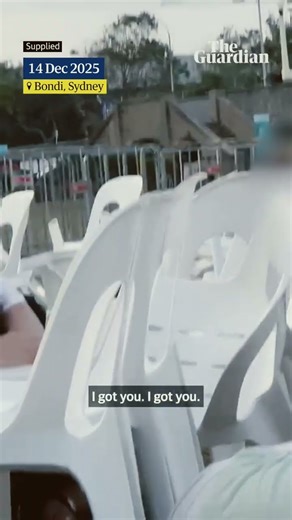 Woman comforts child she doesn't know as Bondi shooter opens fire