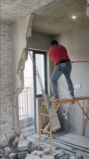 The process of demolition existing brick wall