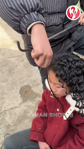 The process of perming hair with fire hook