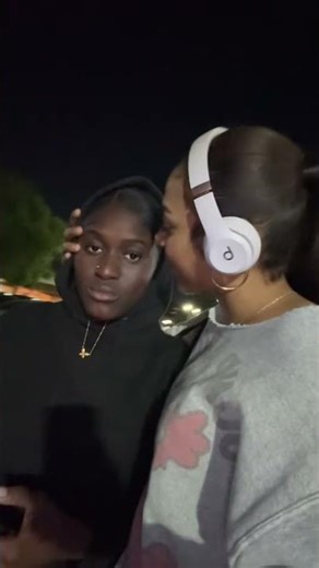 Sweet Moments: Friends Share Affectionate Kiss and Playful Bite#friendshipgoals