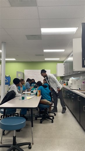 College Instructor and Students Learning and Laughing