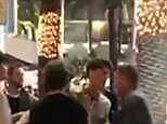 Violent moment a security guard HEADBUTTS rowdy patron