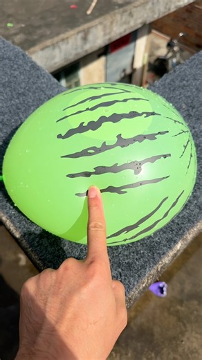 Experiment: Will a water balloon explode if it rolls down a tall building? 💥🎈 #balloon