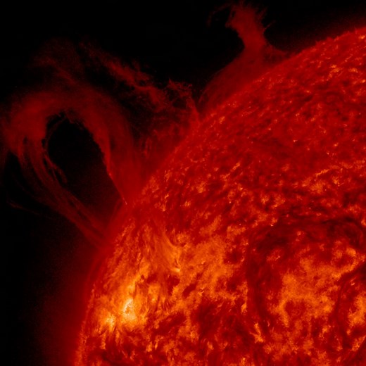 Curly-Q Filament Blast • A solar filament erupted in the shape of a twisted arch over a three-hour period (Feb. 4, 2015) with most of it falling back into the Sun. The activity in the lower corona was caught in a wavelength of extreme ultraviolet light. Filaments are elongated clouds of particles suspended above the Sun's surface by magnetic forces. They are notoriously unstable. Credit: Solar Dynamics Observatory, NASA. | Astronomy Nation