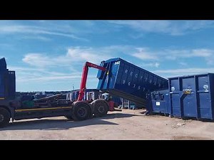 ¿Cómo se carga un contenedor de residuos?