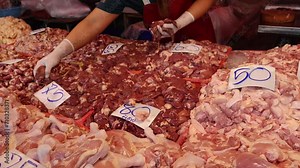 Sorting Chicken at a Market Stall