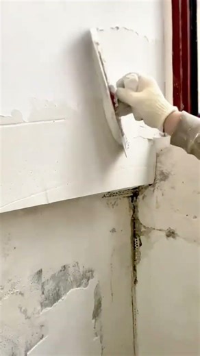 Repairing Cracked Wall Surface With Fresh Plaster Around Window