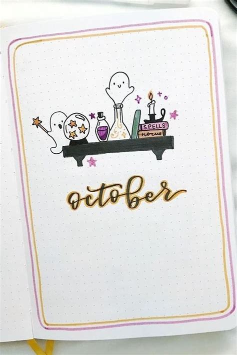 An Open Notebook With The Word October Written In Gold On It And Two
