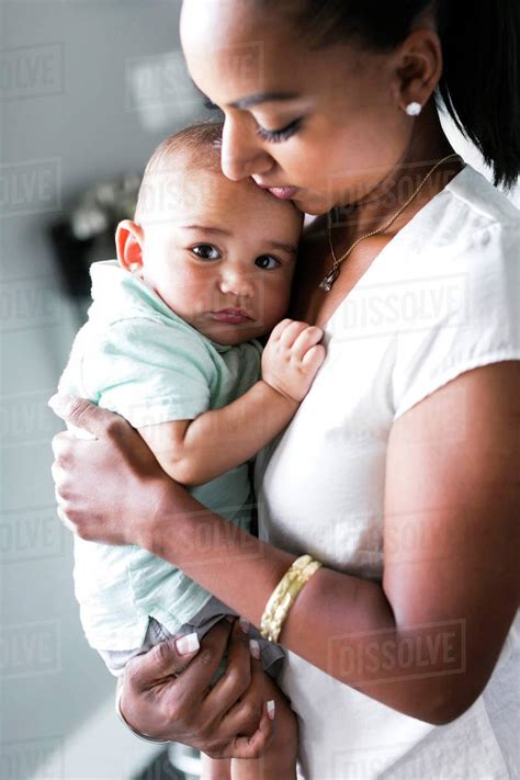 Portrait Of Mother Holding Baby Boy 2 5 Months Stock Photo Dissolve