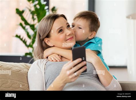 Son Kissing Pregnant Mother Hi Res Stock Photography And Images Alamy