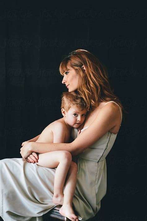 Mother Serenely Holding Her Son By Stocksy Contributor A Model