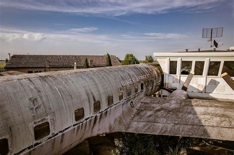 Premium Photo Abandoned And Vandalized Airplane At Sunset