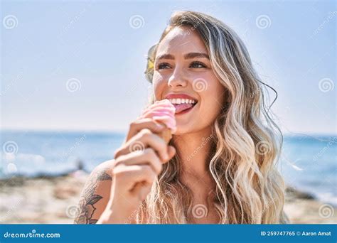 Young Blonde Girl Wearing Bikini Eating Ice Cream At The Beach Stock Image Image Of Cream
