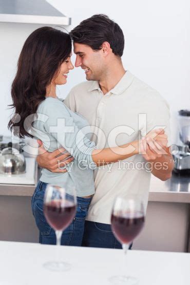 Couple Slow Dancing In The Kitchen With Glass Of Red Wine On The Table In 2019 Couples Slow