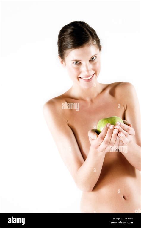 Naked Woman Holding A Green Apple Studio Stock Photo Alamy