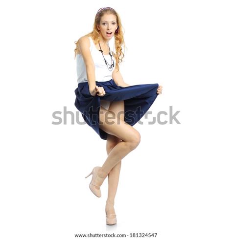 Zdjęcie Stockowe „surprised Girl Lifts Her Skirt” 181324547 Shutterstock