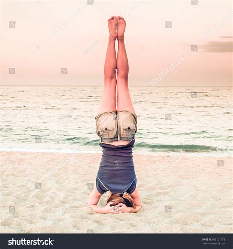 Girl Practice Yoga Headstand On Beach Stock Photo 645101773 Shutterstock