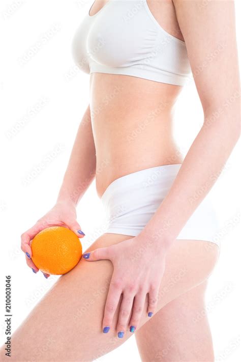 Beautiful Slim Female Body And Supple Female Legs With Orange Isolated
