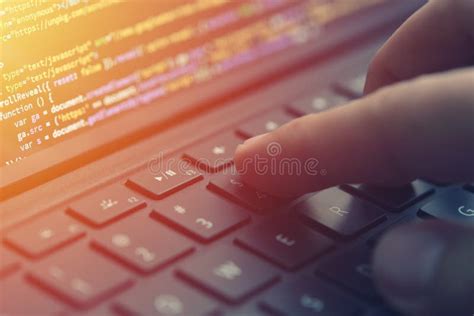 closeup coding on screen hands coding html and programming on screen laptop web development