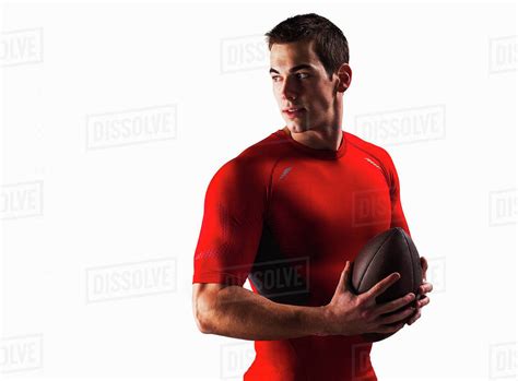 Athletic Man Holding Football Stock Photo Dissolve