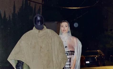 Bianca Censori Seemingly Nude Under Transparent Raincoat While Out With Kanye West See Photos