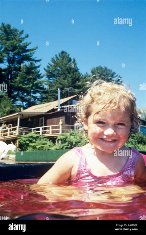 SMILING GIRL IN LAKE Stock Photo Alamy