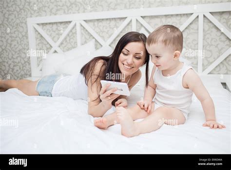 Mother And Son In Bed Stock Photo Alamy
