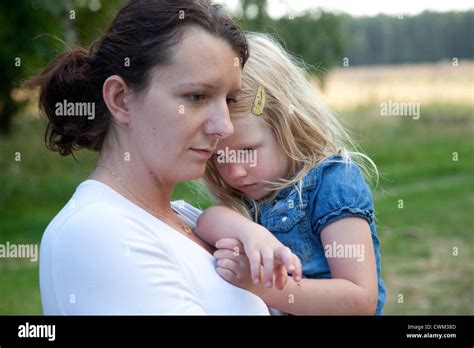 Polish Mom Having A Somber Moment Holding Her Daughter Age 32 And 4 Zawady Central Poland Stock